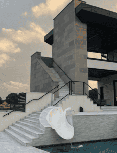 Luxury Backyard Pools With Slides: Design Ideas - arinsolangeathome